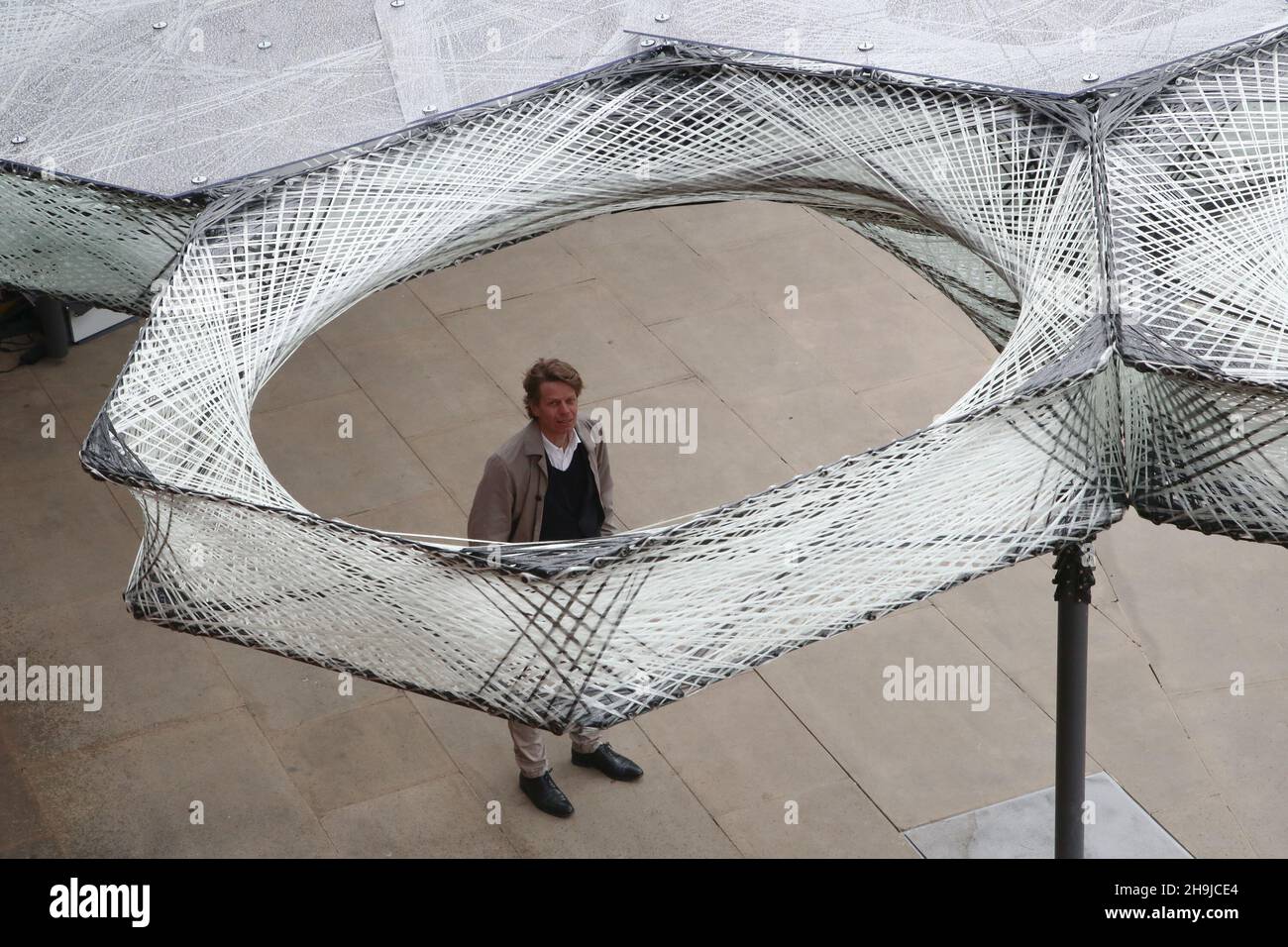 Structural engineer Jan Knippers looks through one of the hexagons in a ...