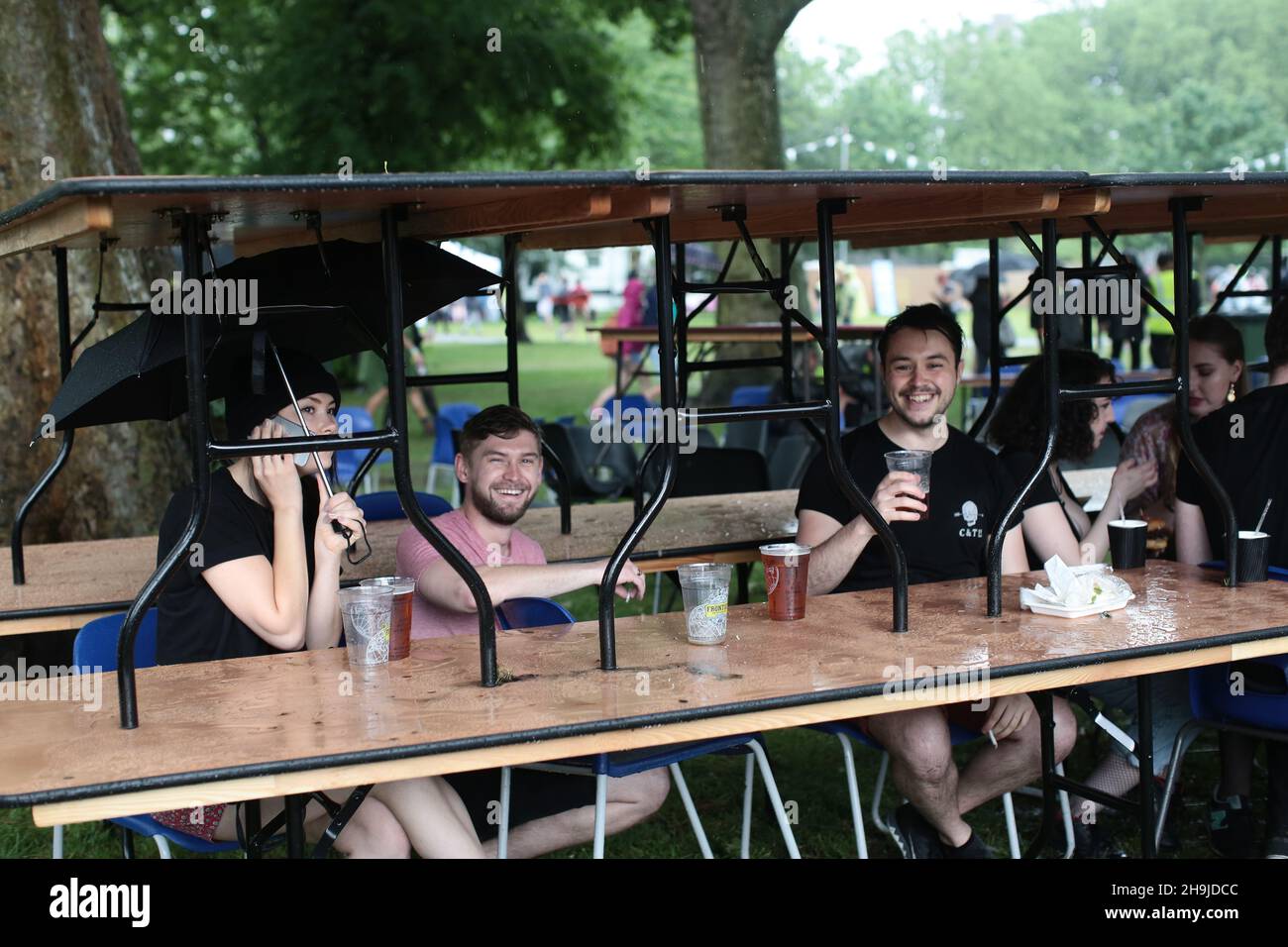 Festival goers in the rain on the first day of the Field Day Festival ...