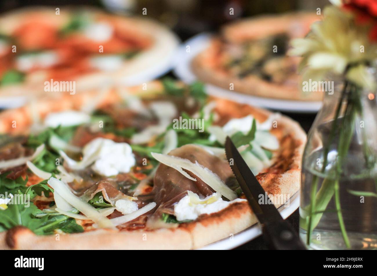 Pictures of people eating and being served pizza at Bush Hall's ...