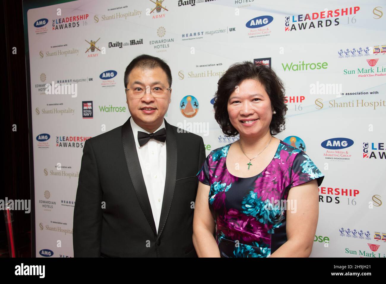 Frank Leung and his wife posing for photos before the 2016 GG2 ...