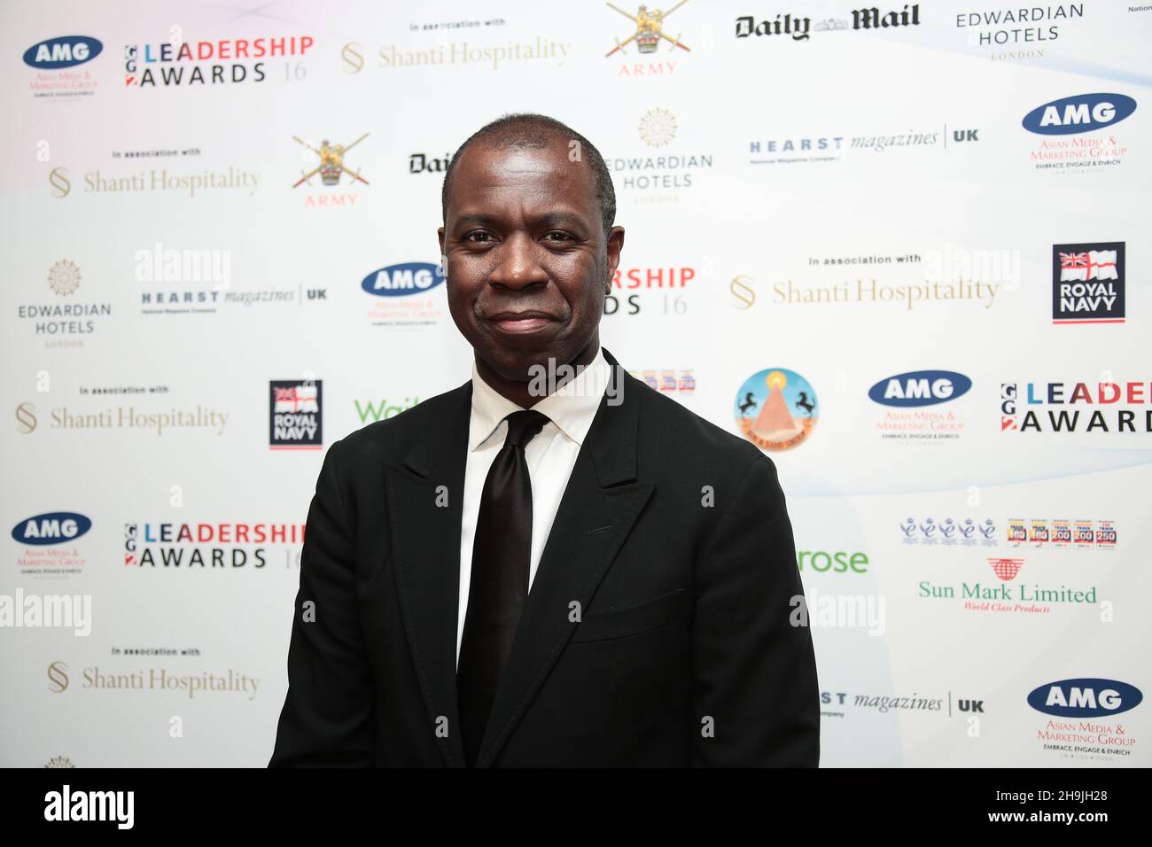 Clive Myrie posing for photos before the 2016 GG2 Leadership Awards at ...