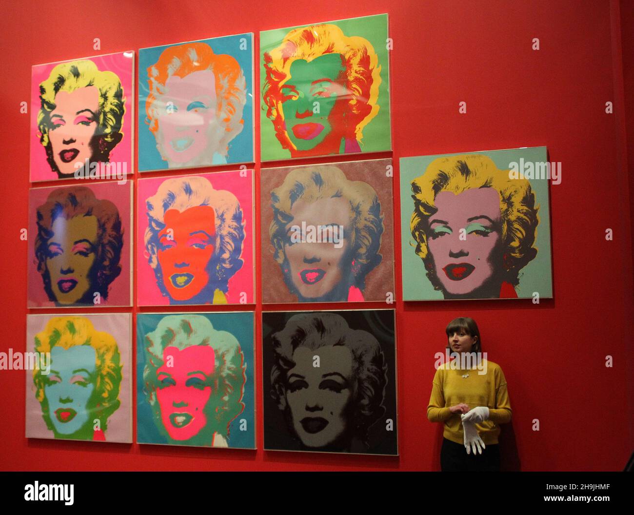 Project curator Catherine Daunt checks 10 "Marilyn" screenprints by ...
