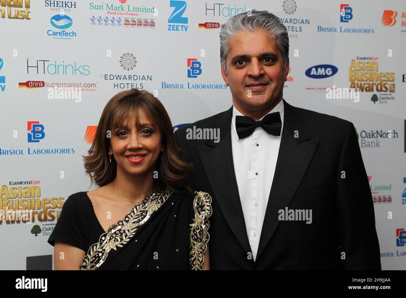 Riz Lateef posing for photos on the red carpet before attending The ...