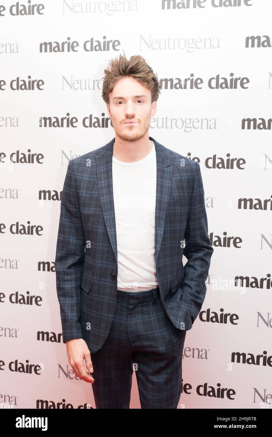 James Stewart posing for photos on the red carpet before attending the ...