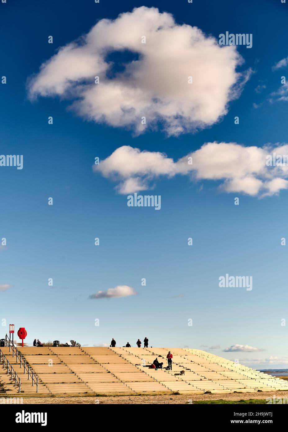 White cloud against blue sky floating above new seawall at Lytham ...