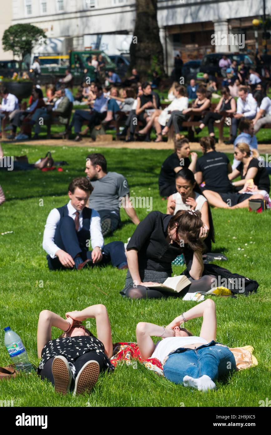 Office workers enjoy the warm spring weather at lunchtime in Berkeley ...