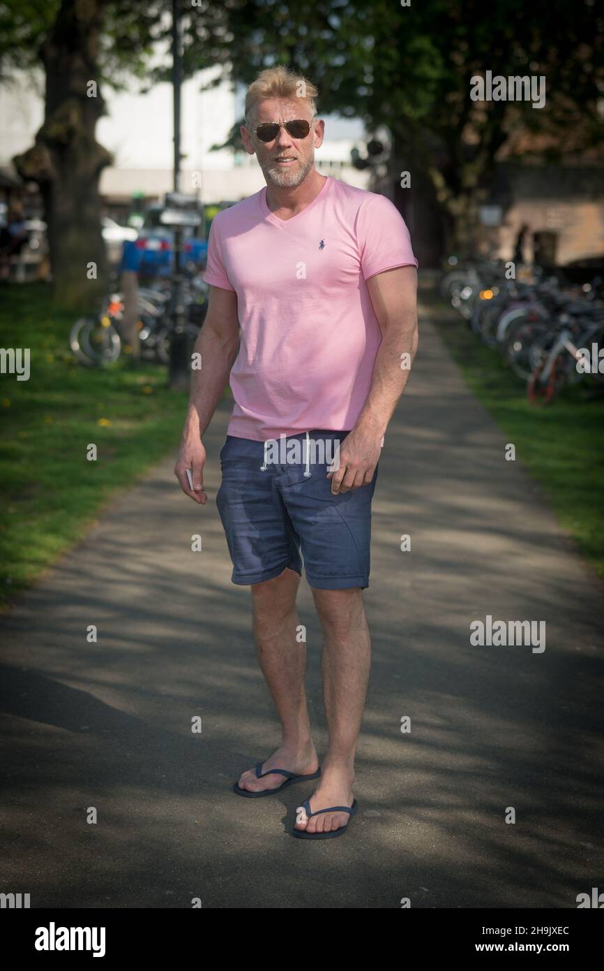 Paul Maskell poses for photos as part of a series showing men wearing ...