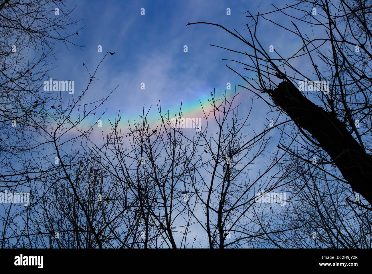 A rainbow in the winter sky Stock Photo - Alamy