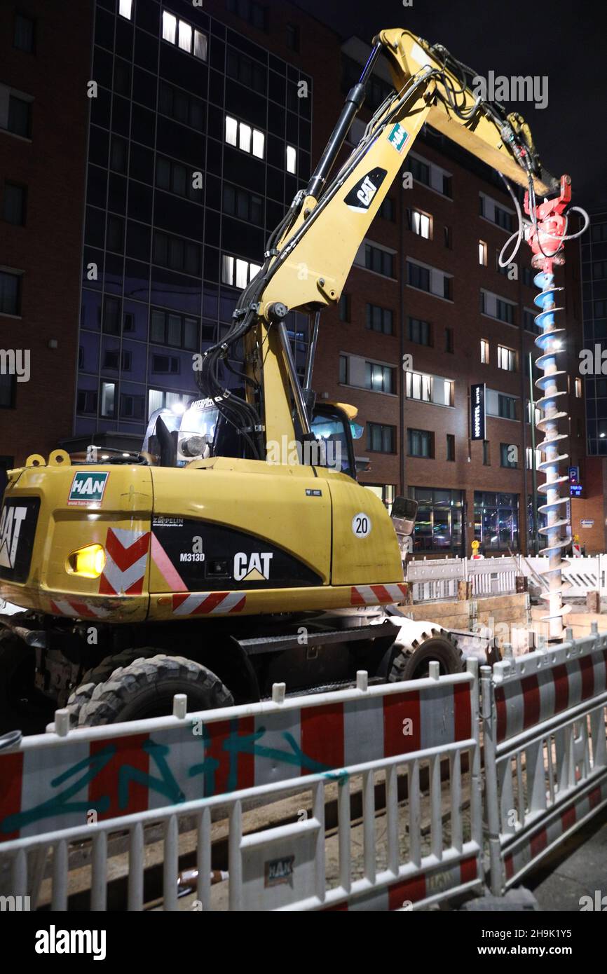 Wheeled CAT Road Construction Vehicle and Auger Drill in Central Berlin ...