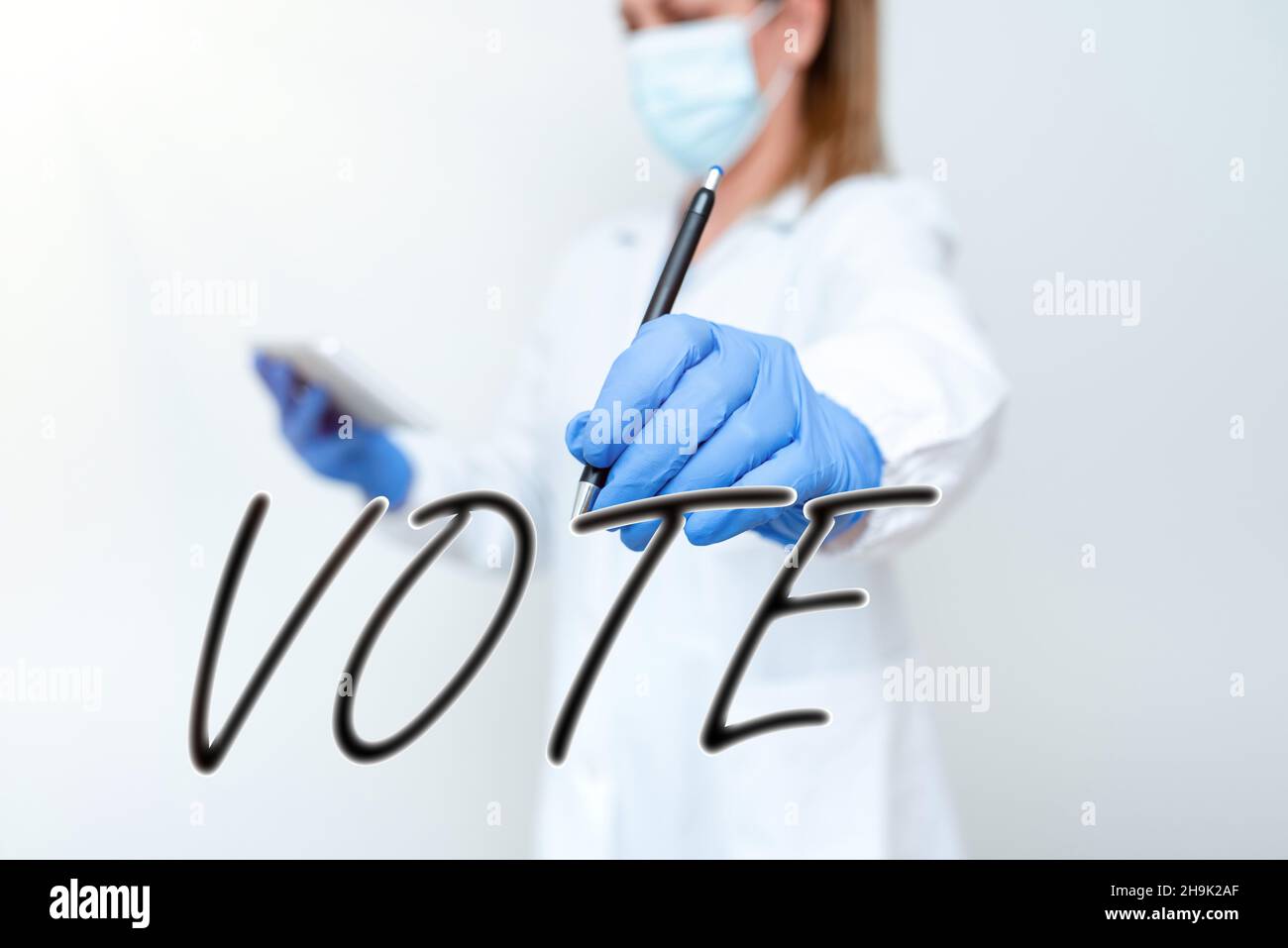 Hand writing sign Vote. Business concept Act of expressing a formal ...
