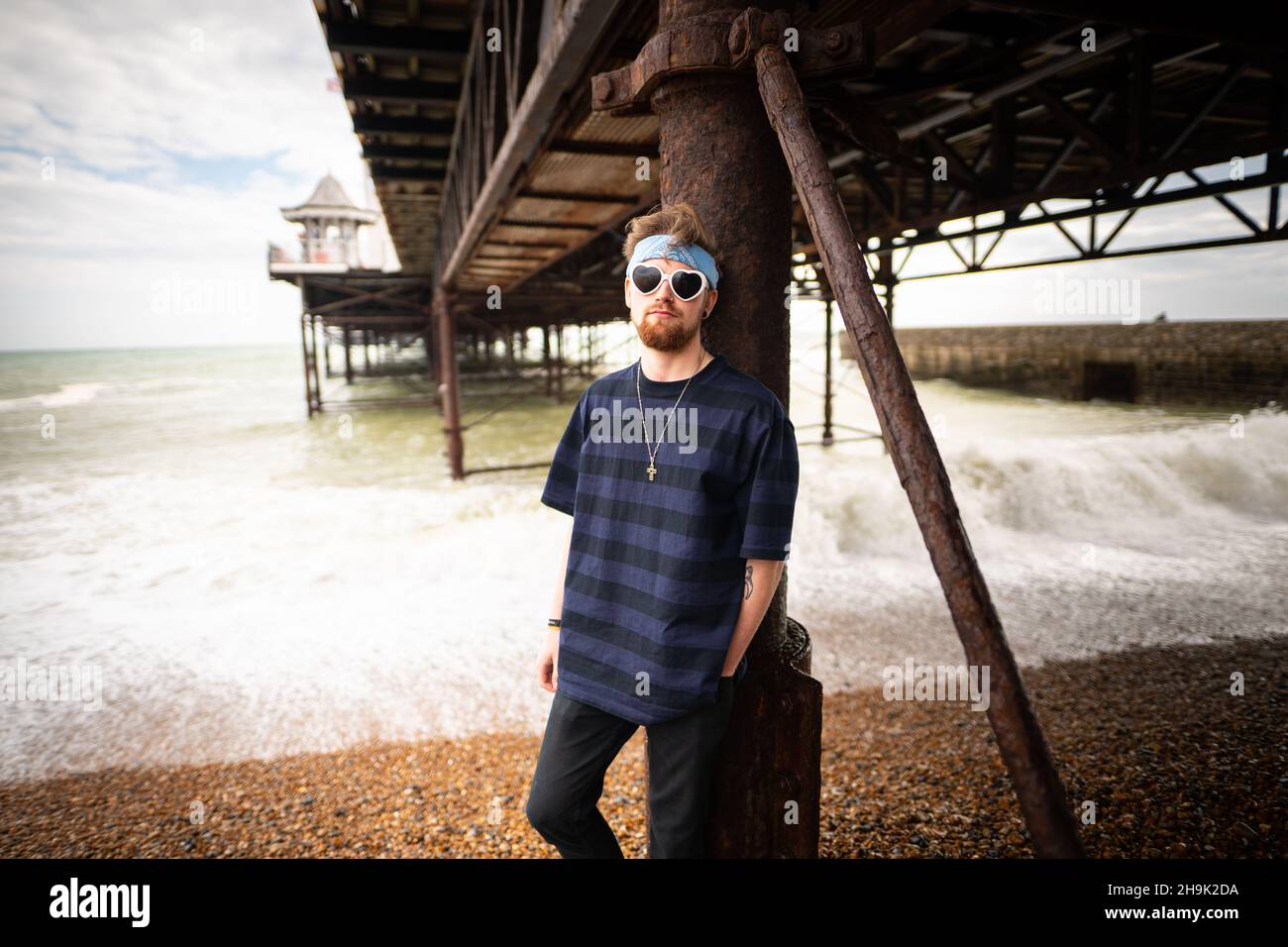 Hugh Aitchison of Dr!ftwood posing for photos on the beach during the ...