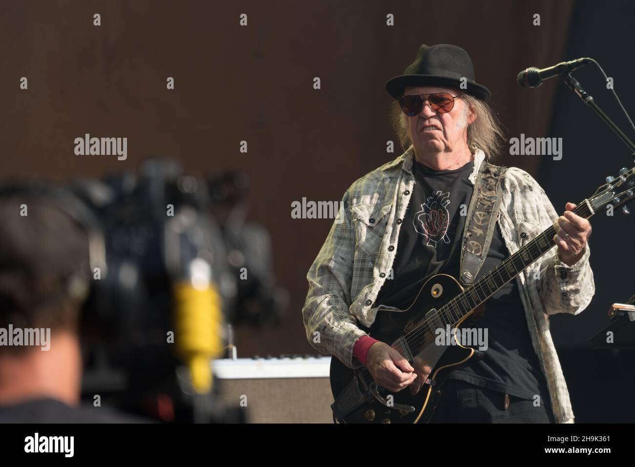 Neil Young performing live on stage in Hyde Park in London. Photo date ...
