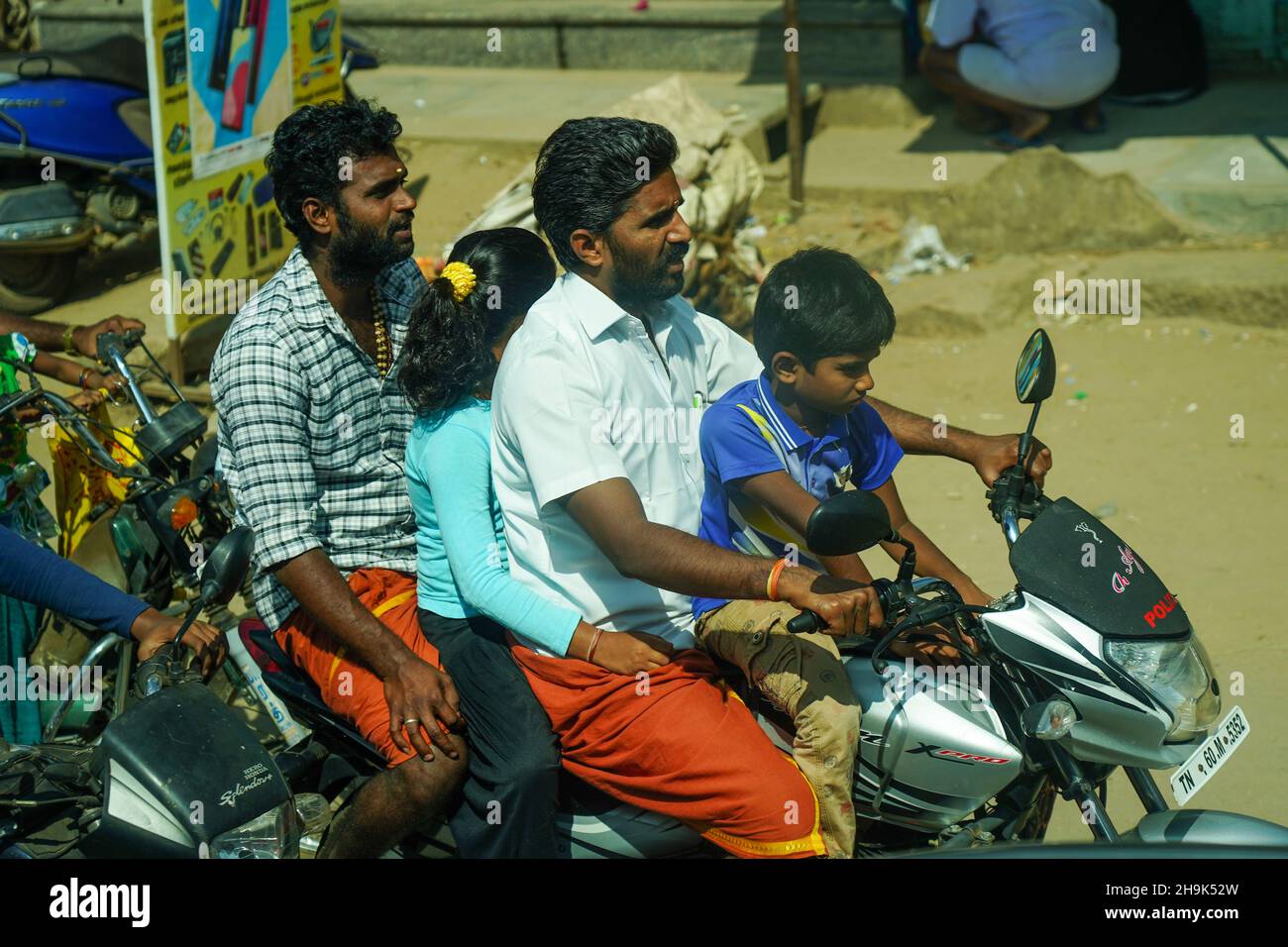 Views of riders of motorcycles and mopeds in Kerala. From a series of ...