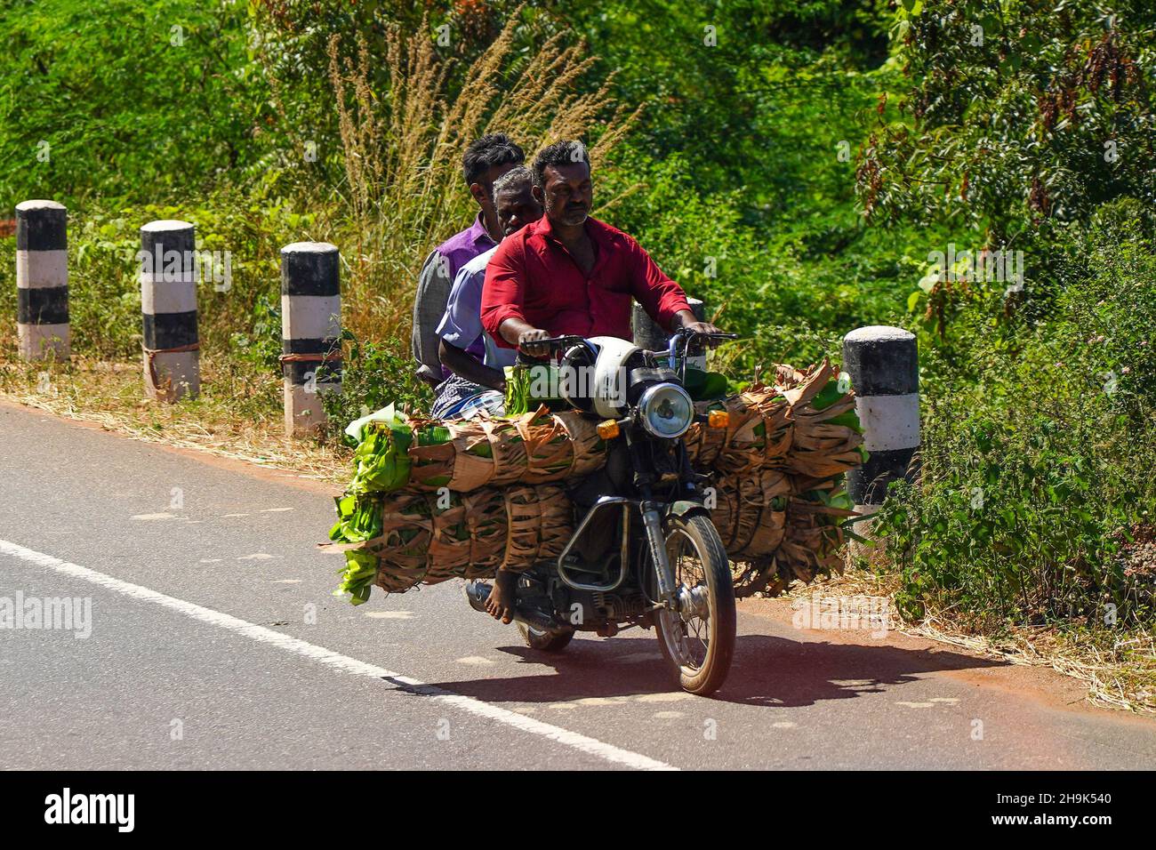 Views of riders of motorcycles and mopeds in Kerala. From a series of ...