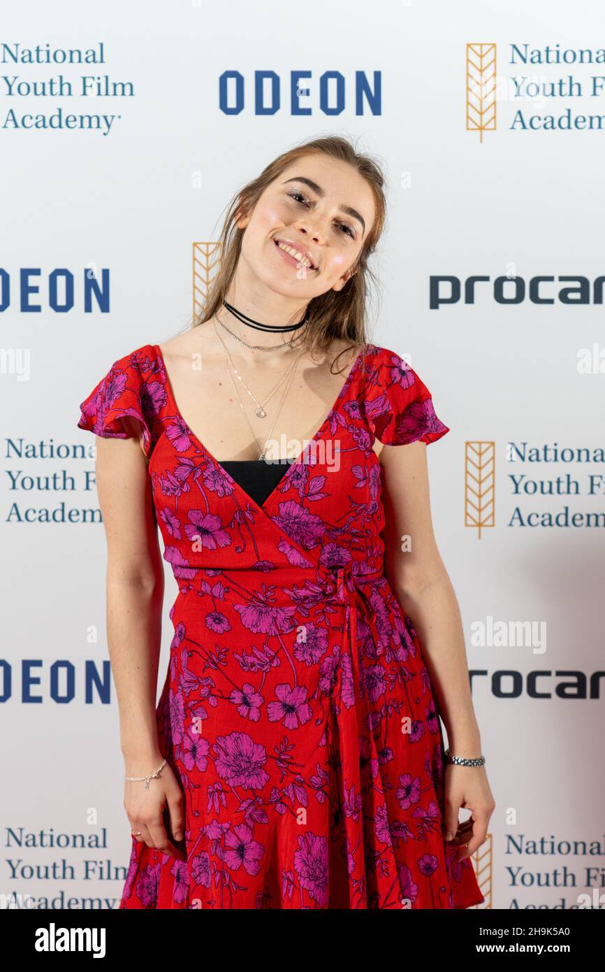 Ellie Ekers posing for photos on the red carpet before attending the ...