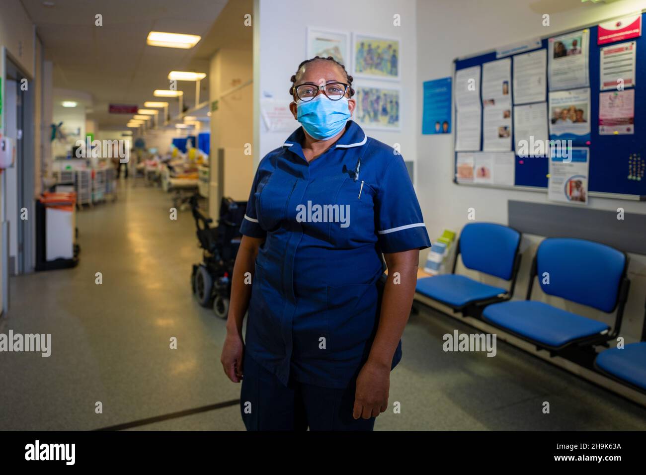 An NHS staff member wearing a protective mask poses for a portrait on ...