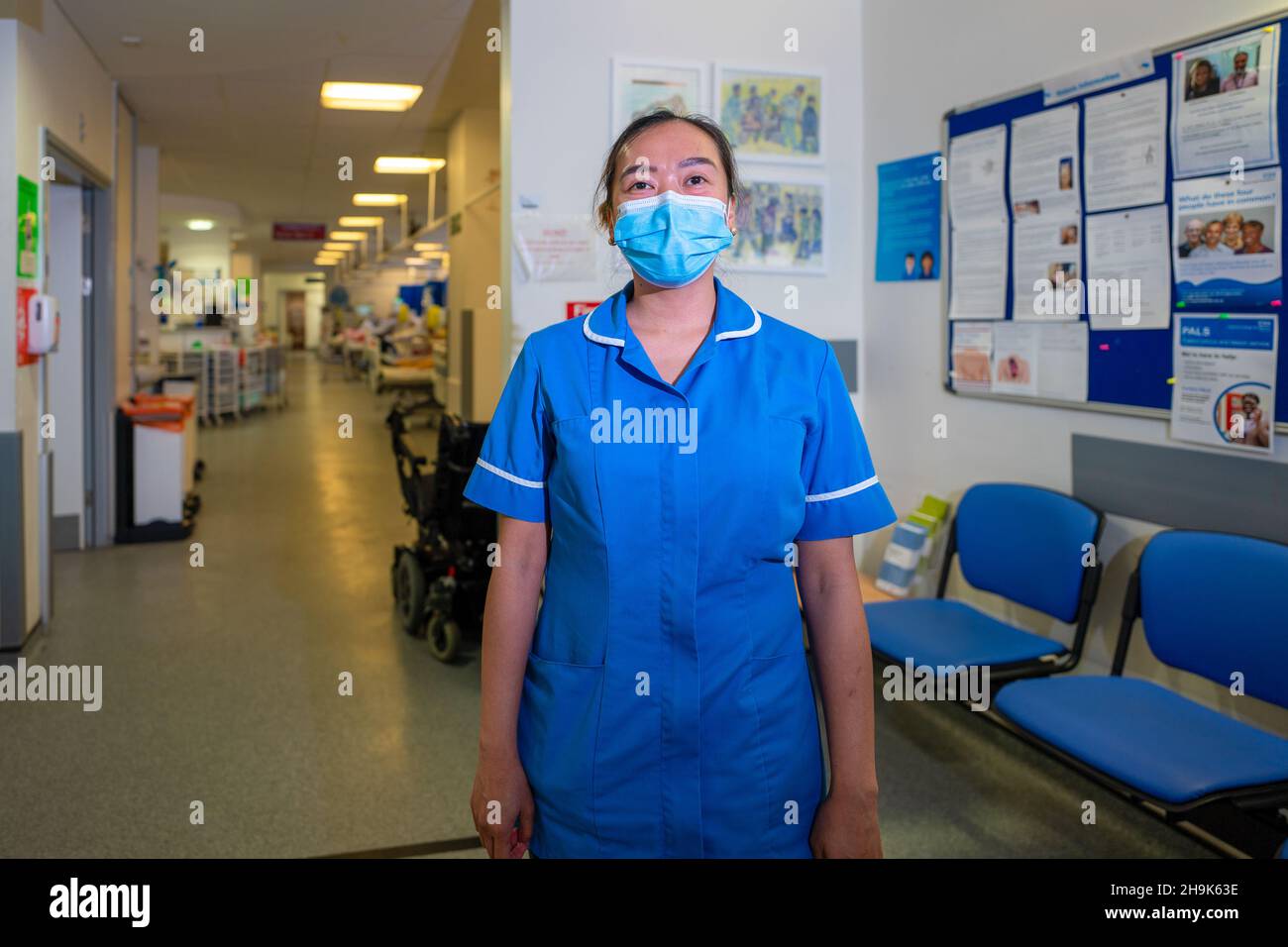 An NHS staff member wearing a protective mask poses for a portrait on ...