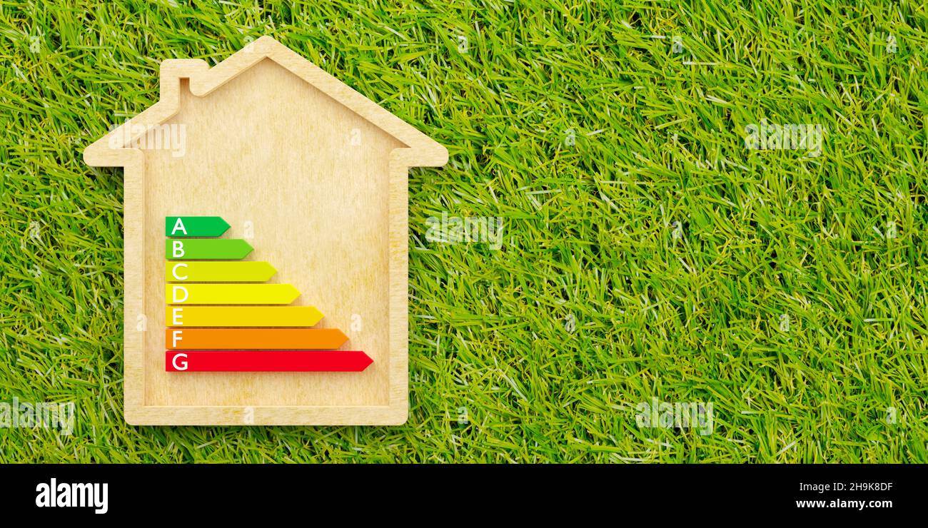 European energy classification label in wooden house on grass ...