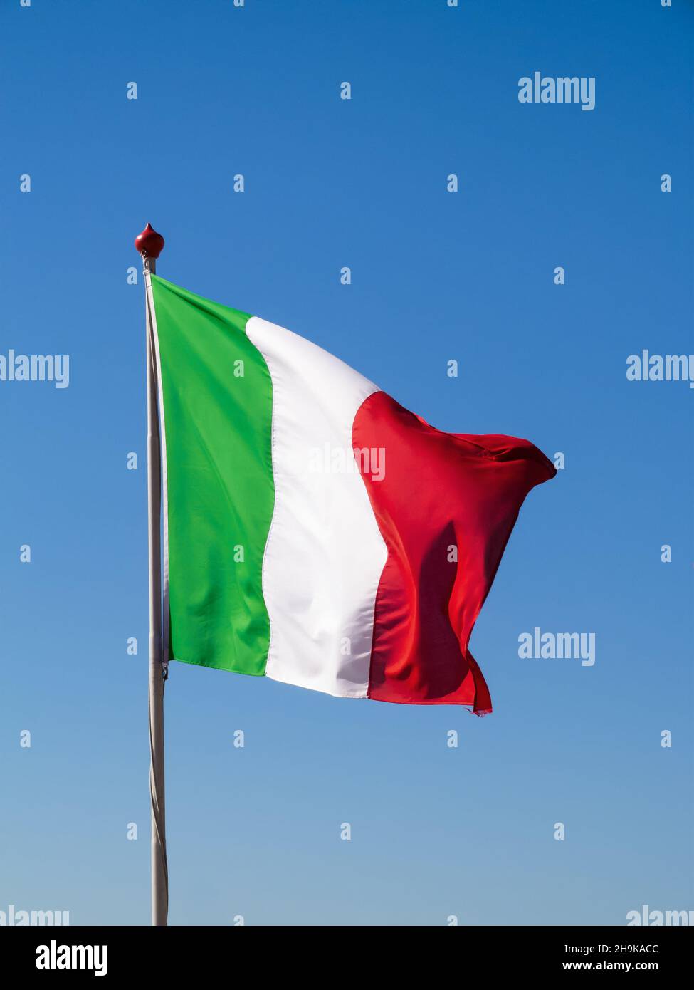 Italian flag pole against clear blue sky Stock Photo - Alamy
