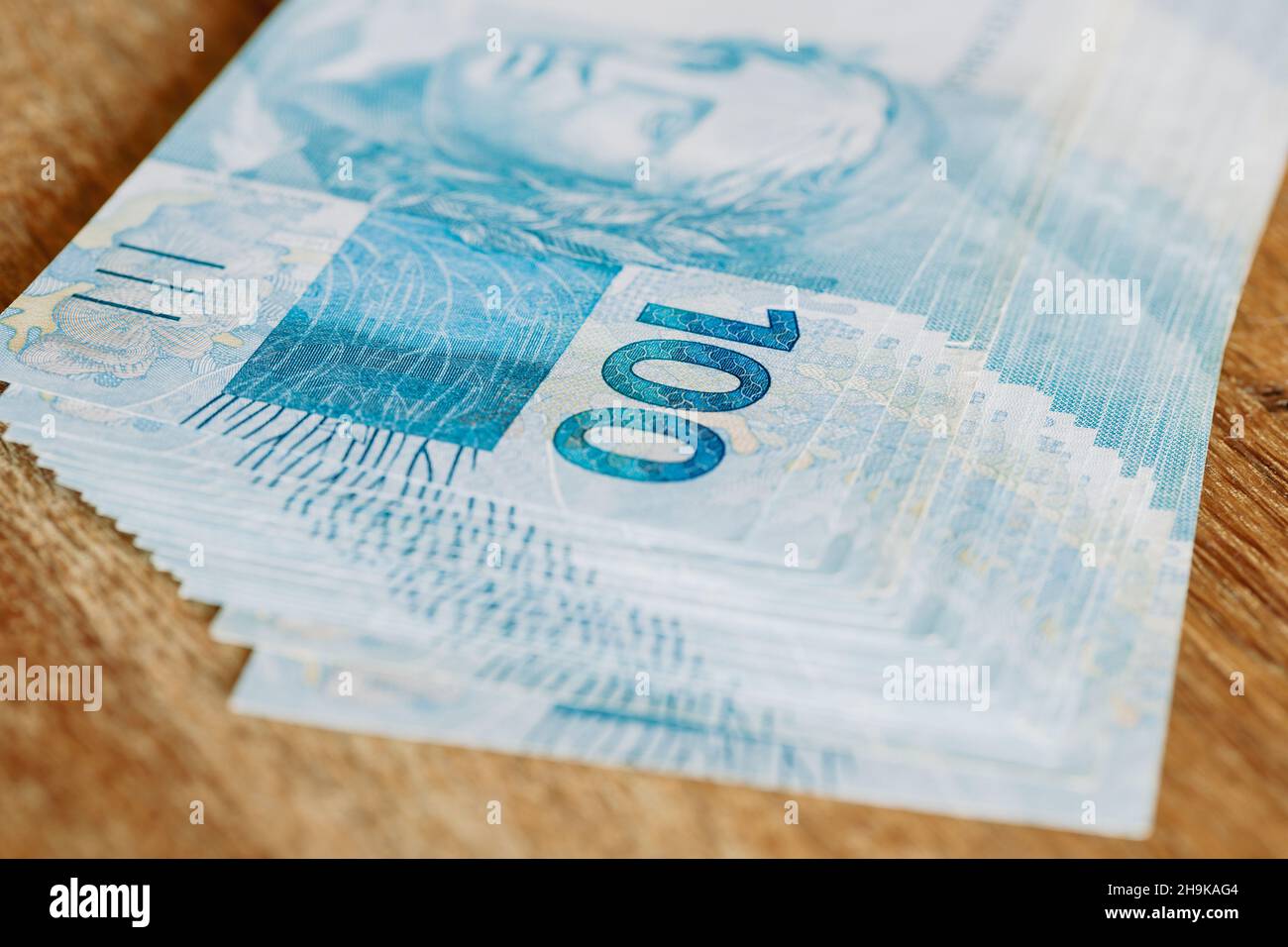 A large sum of Brazilian money, A bundle of banknotes of 100 Reais ...
