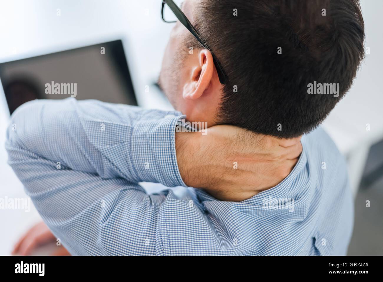 Muscular man holding laptop hi-res stock photography and images - Alamy