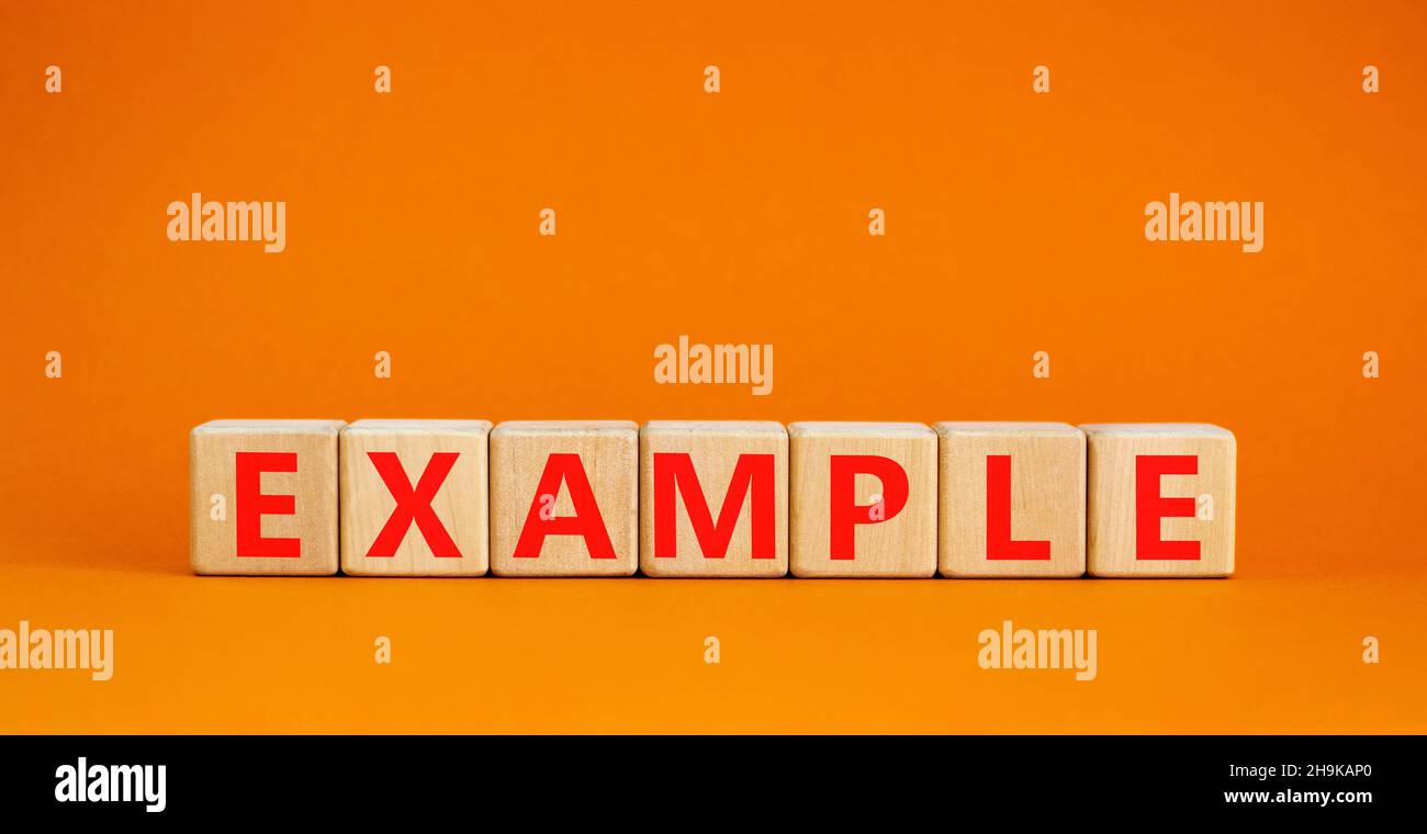 Example symbol. The concept word Example on wooden cubes. Beautiful ...