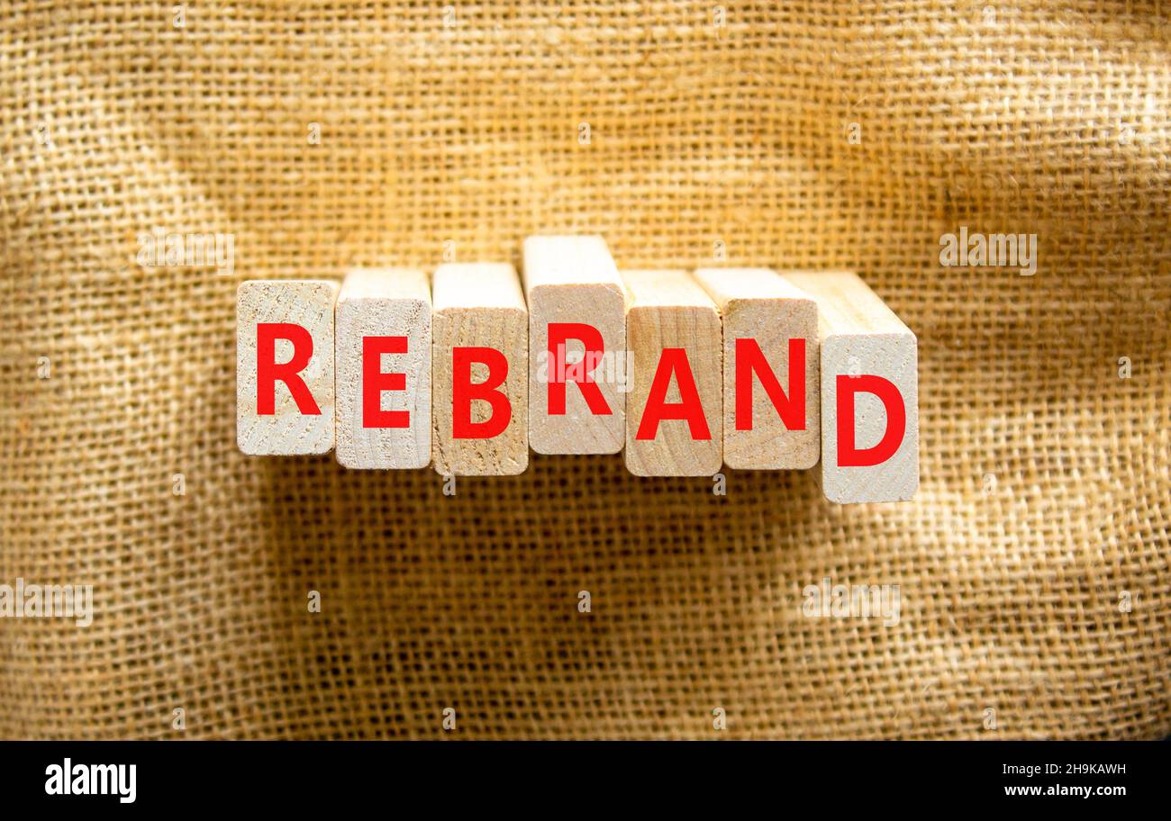 Rebrand and brand symbol. The concept word Rebrand on wooden blocks ...