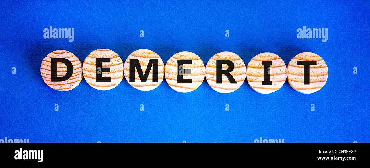 Demerit symbol. The concept word Demerit on wooden circles. Beautiful ...