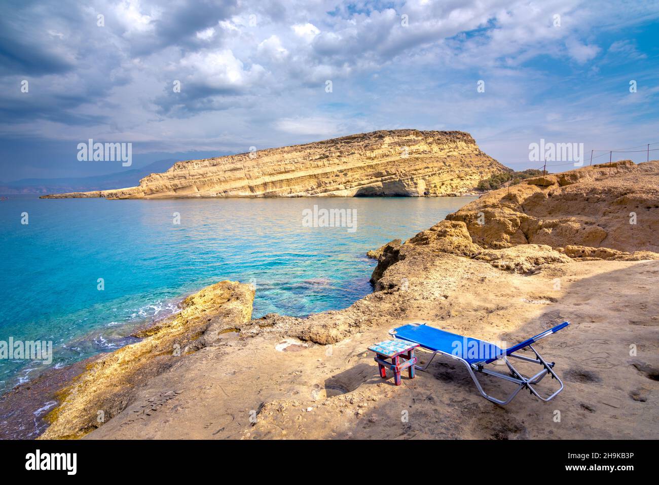 Matala beach with caves on the rocks that were used as a roman cemetery ...