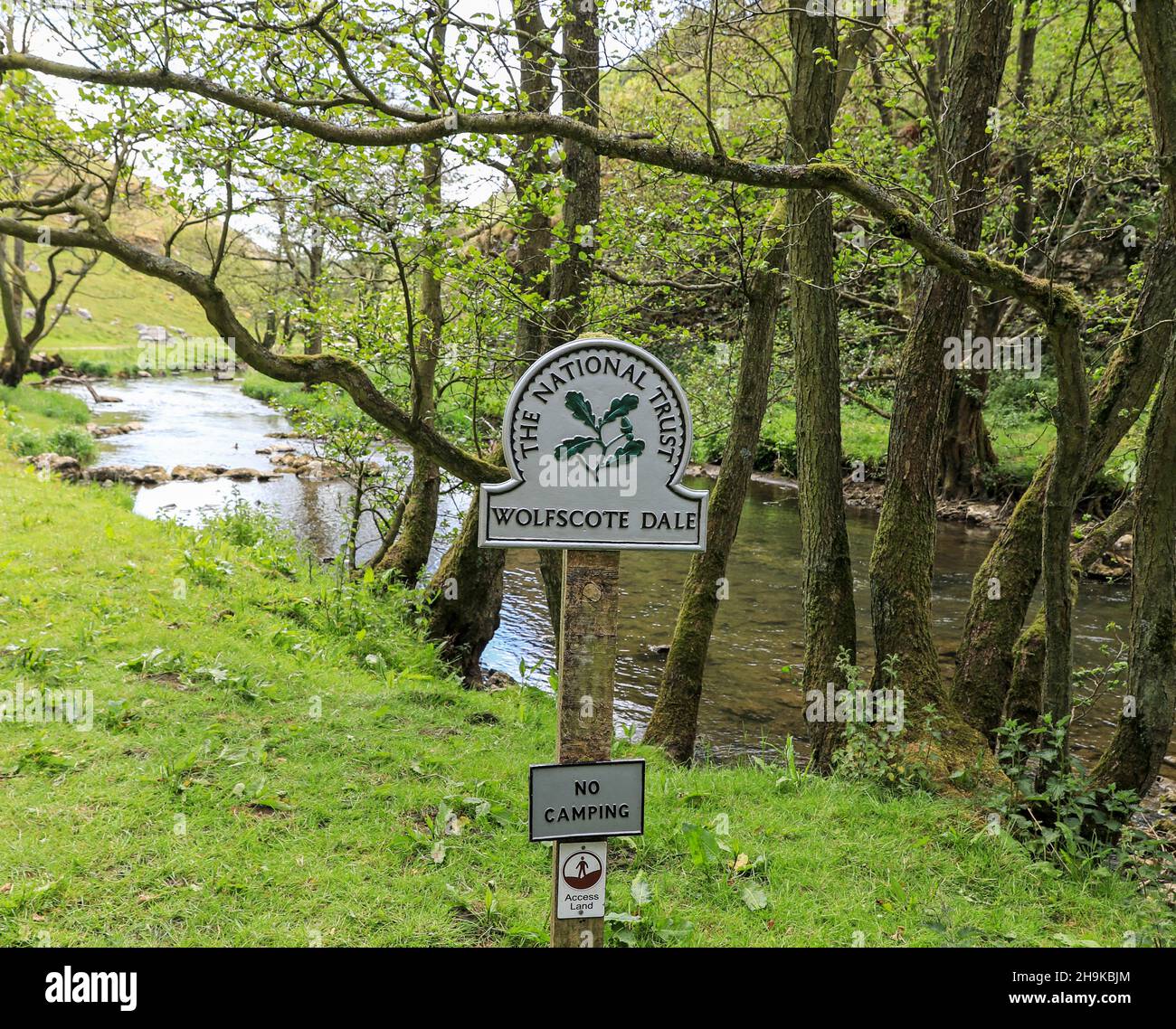A National Trust omega sign at Wolfscote Dale in the Derbyshire and ...