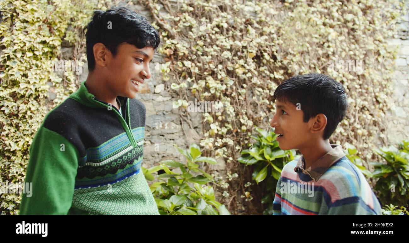 Shallow focus of young Indian boys talking with each other Stock Photo ...