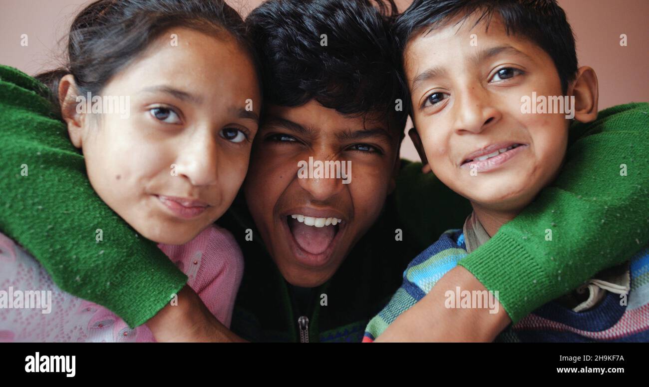 Children huddled together hi-res stock photography and images - Alamy