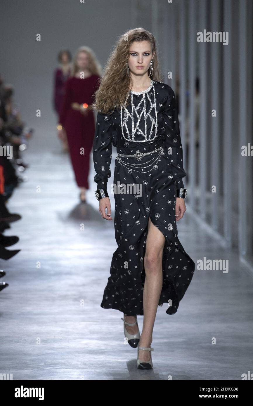 A model walks the runway during the Chanel Metiers D'Art 2021-2022 show ...