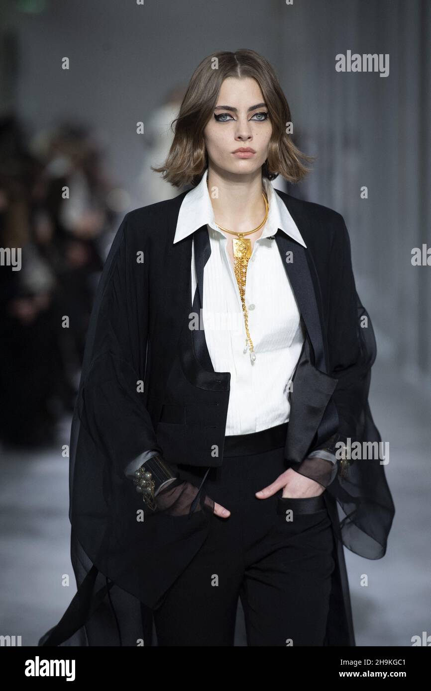 A model walks the runway during the Chanel Metiers D'Art 2021-2022 show ...