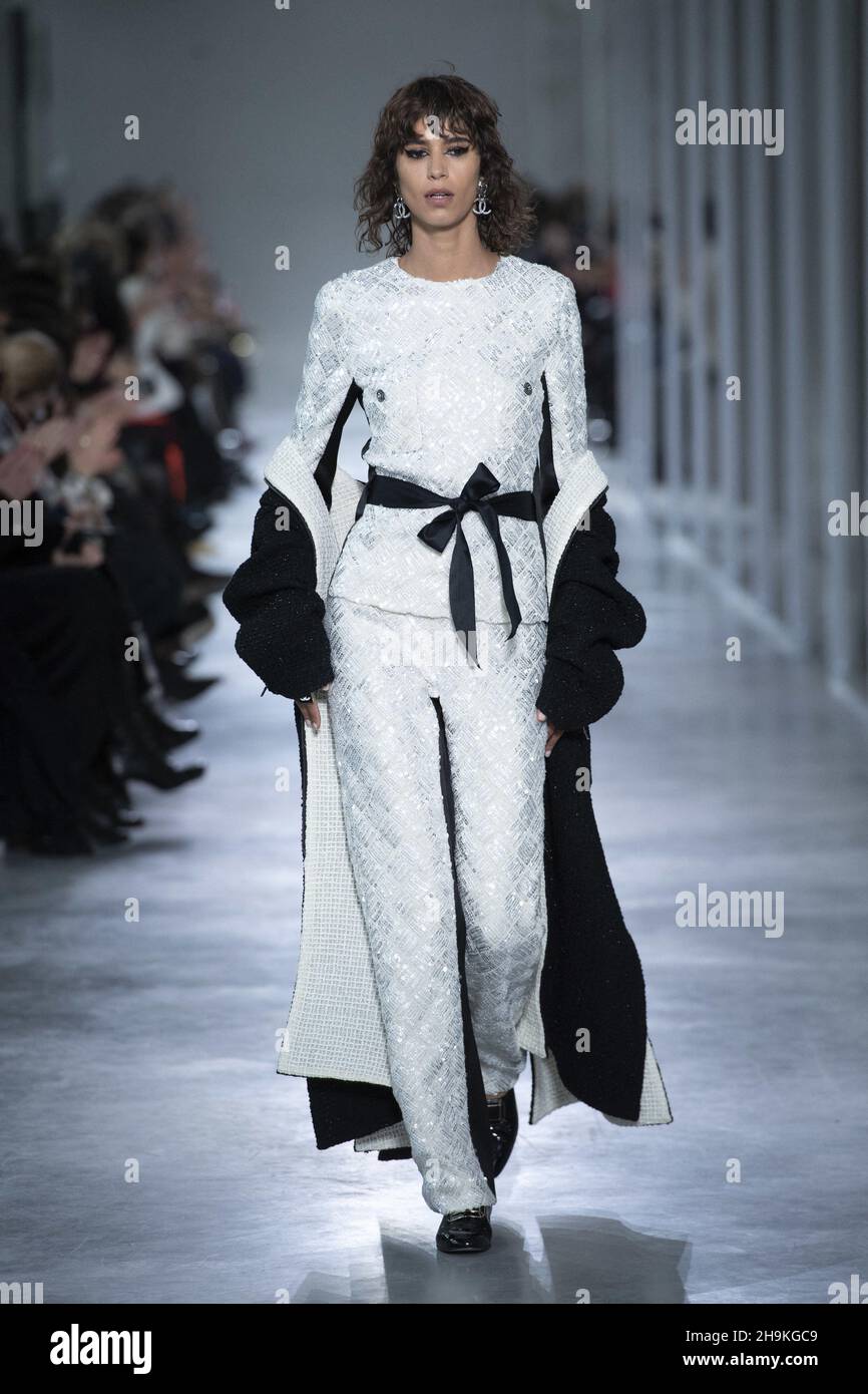 A model walks the runway during the Chanel Metiers D'Art 2021-2022 show ...