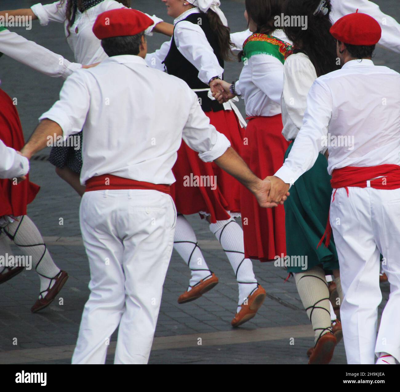 Group of young people in traditional clothing dancing folk dances in ...