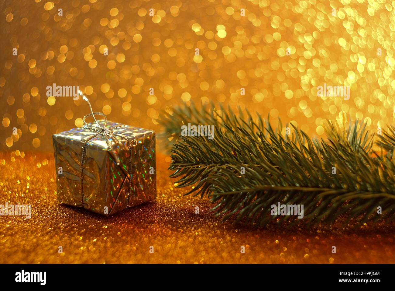 A shiny gift with bokeh in a retro style Stock Photo - Alamy
