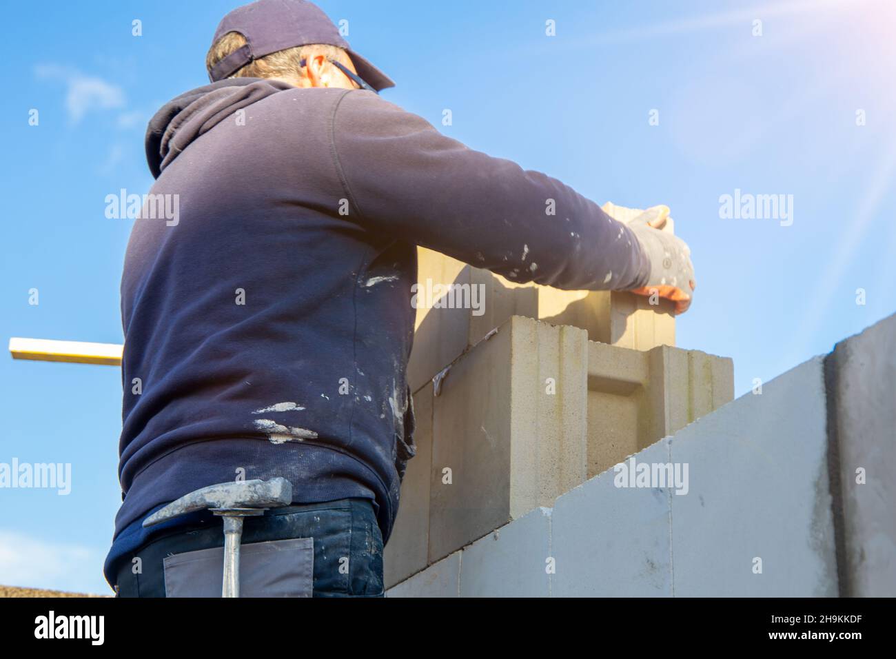 Construction worker (bricklayer) works on the construction site Stock ...