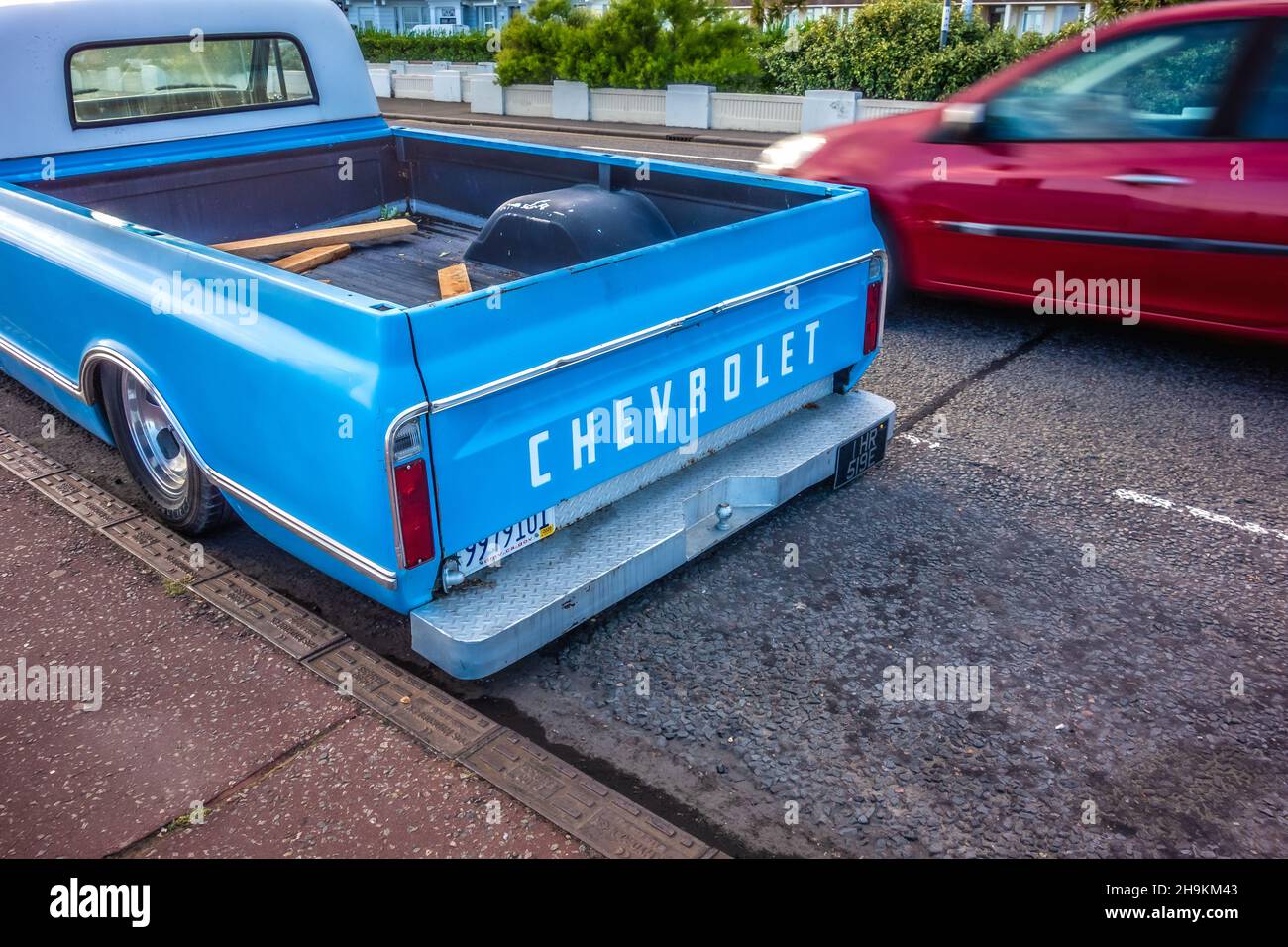 Rear view of a parked Chevrolet C10 pickup truck in pale blue with a ...