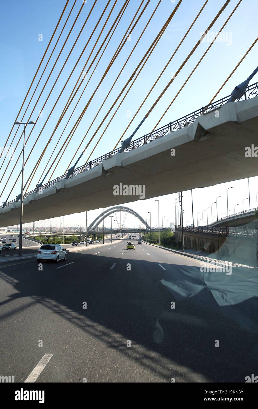 Azerbaijan Baku : 14.05.2021 . Highway asphalt road . Bridge a cable ...