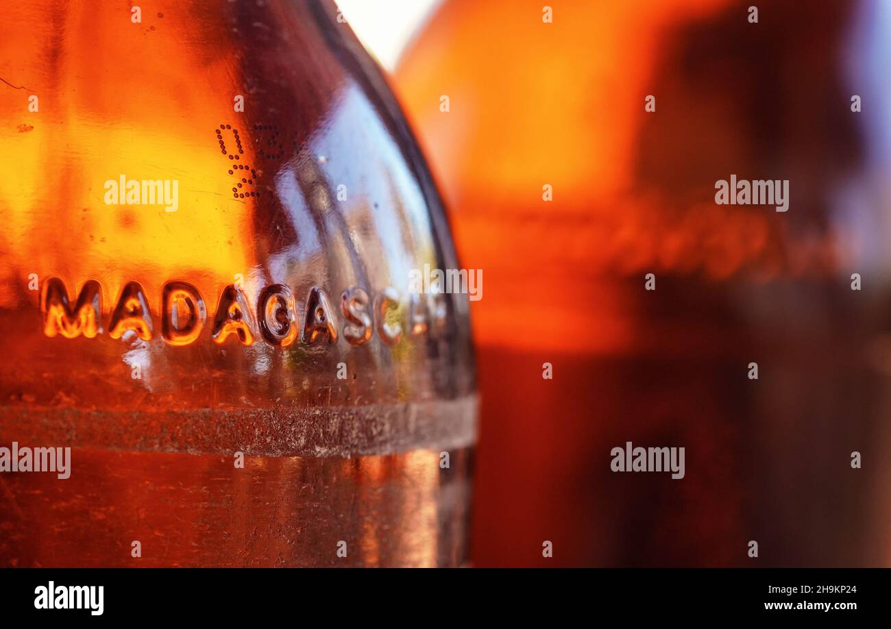 Word MADAGASCAR on beer bottle, closeup abstract detail only few ...