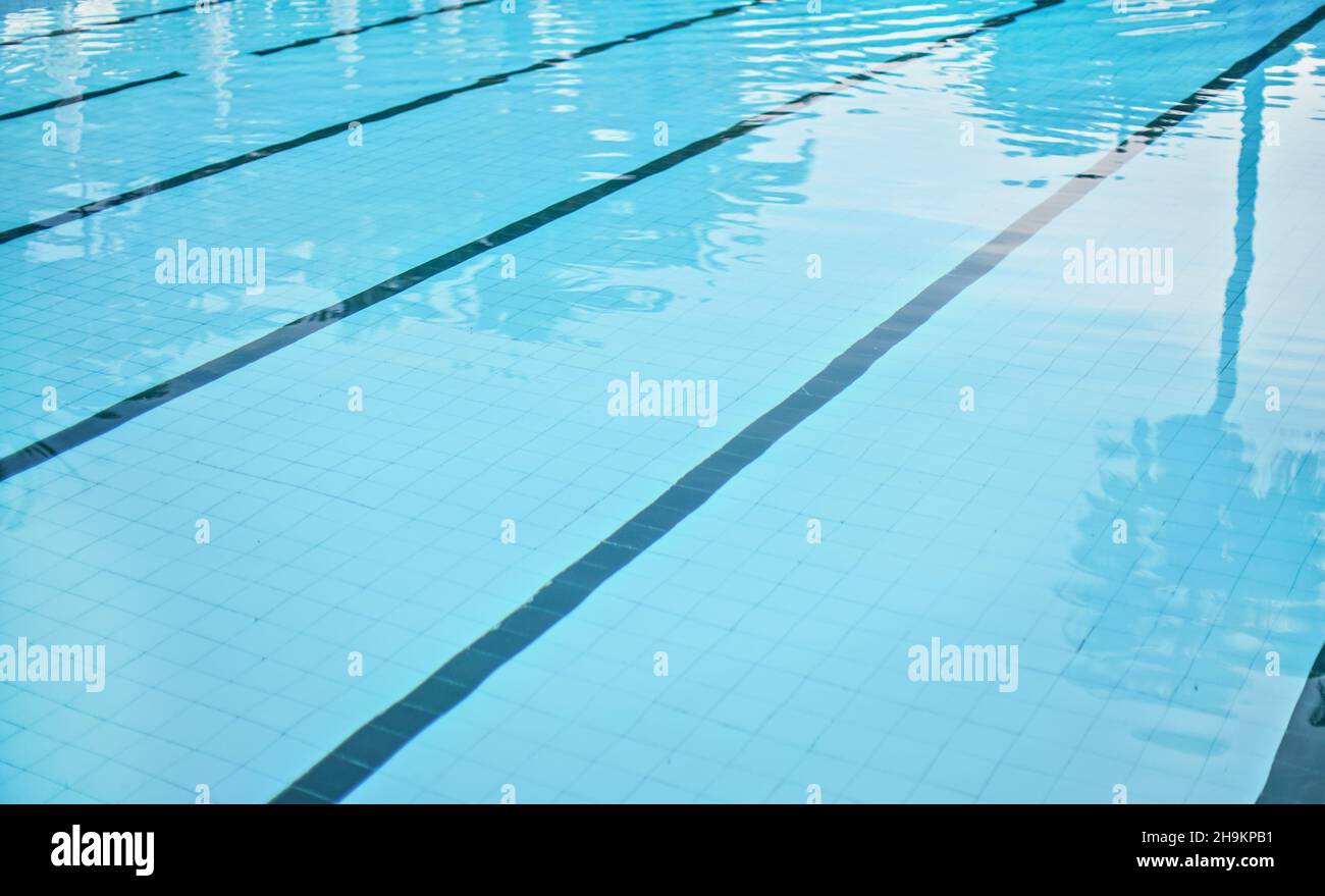 Calm water on empty swimming pool, dark lanes marks visible floor Stock ...