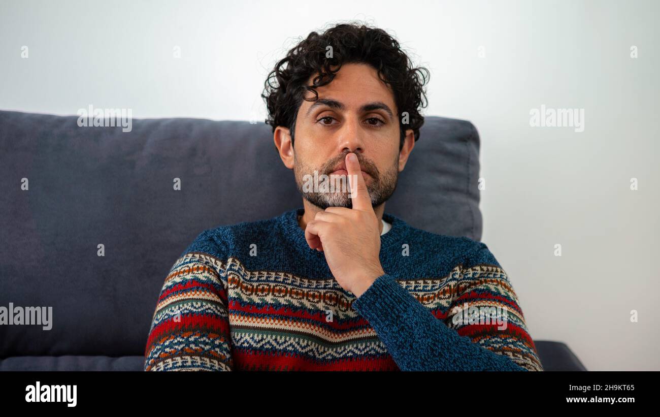 Handsome male model feels concerned puzzled lost in thoughts pondering ...