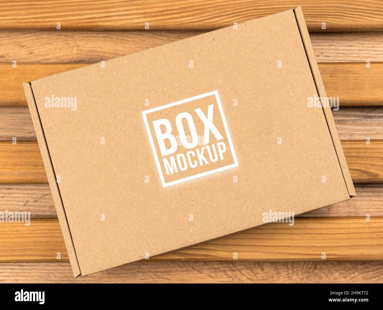 Cardboard box mockup, top view. Wooden table, storage background ...