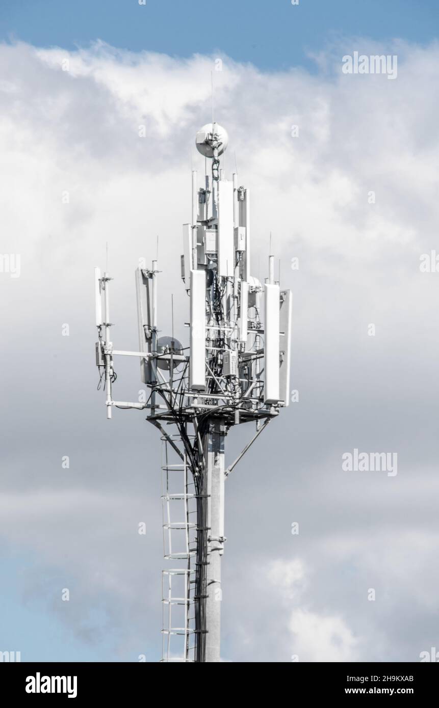Telecommunication antenna tower against the cloudy sky Stock Photo - Alamy