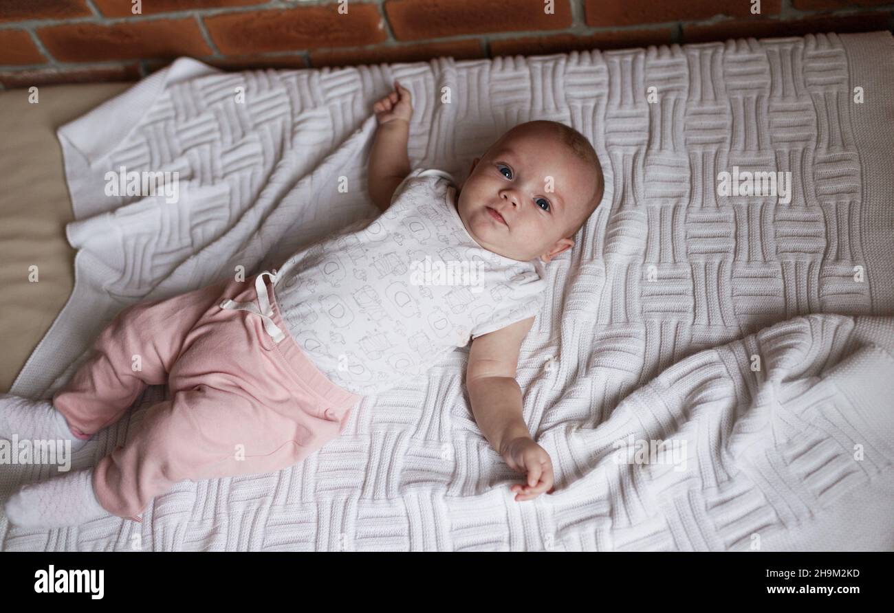 a newborn baby in a crib, the concept of children and the birth Stock ...