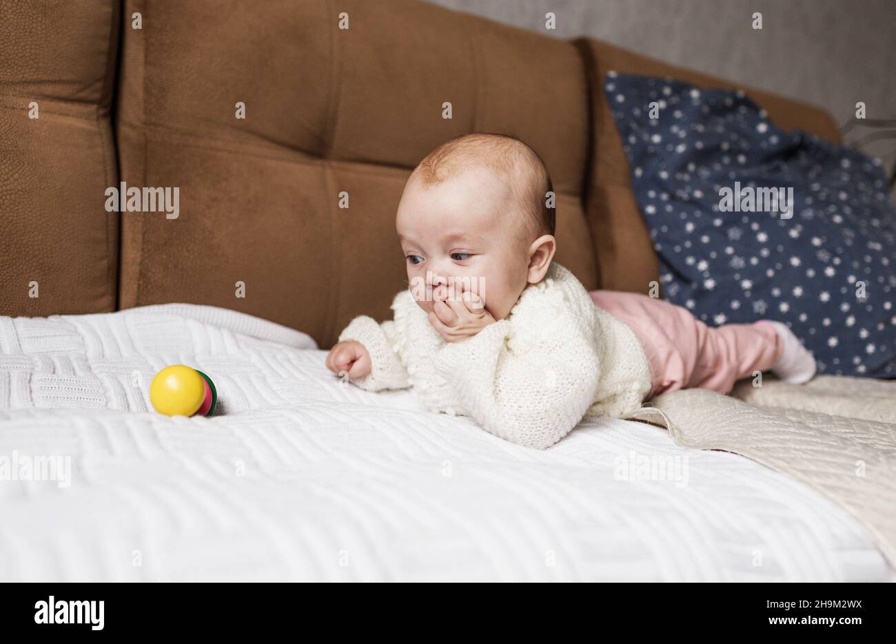 a newborn baby in a crib, the concept of children and the birth Stock ...