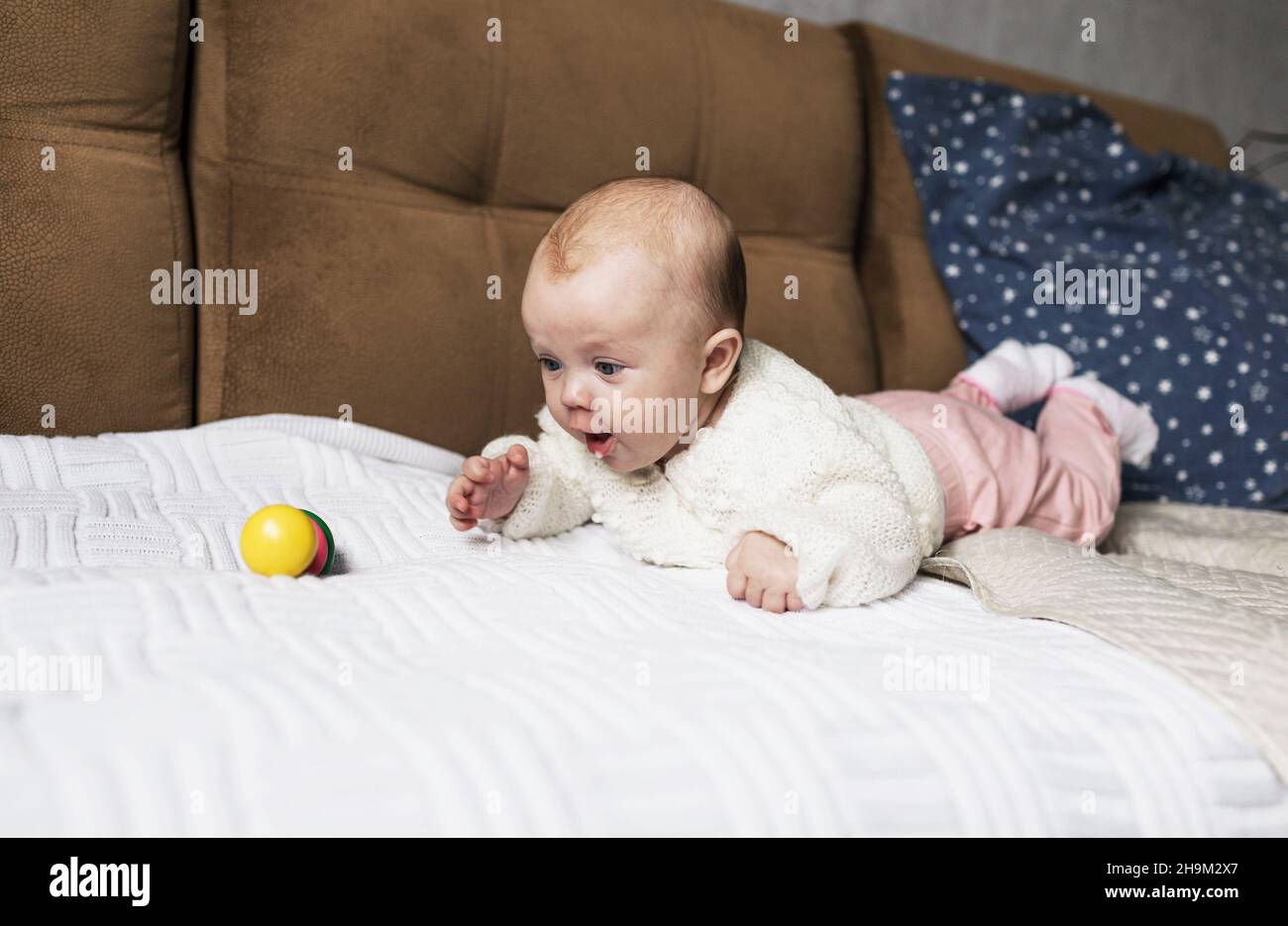 a newborn baby in a crib, the concept of children and the birth Stock ...