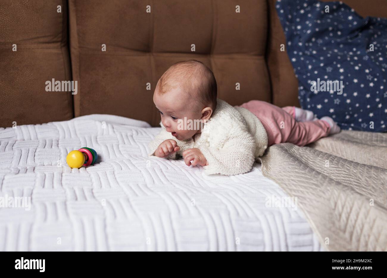 a newborn baby in a crib, the concept of children and the birth Stock ...