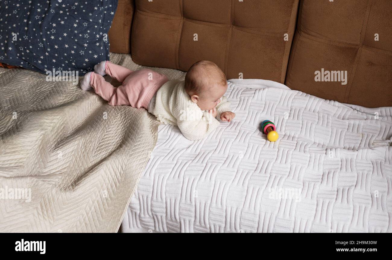 a newborn baby in a crib, the concept of children and the birth Stock ...